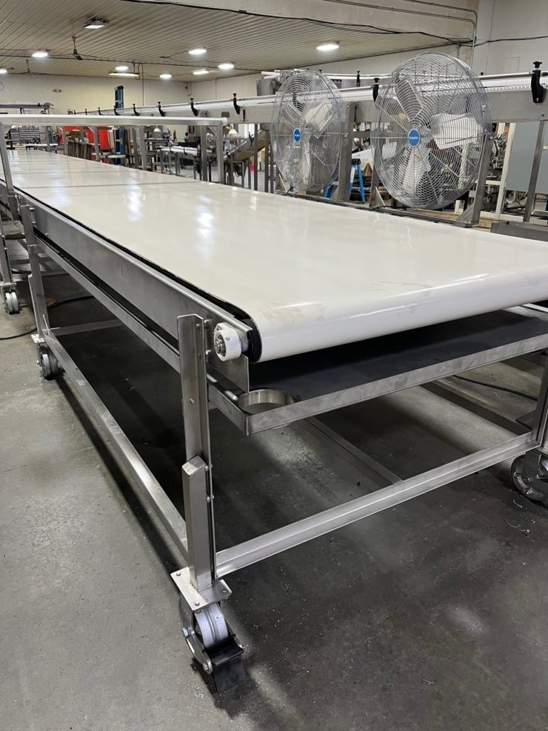 Conveyor with wide white smooth belt - MIPR Corp
